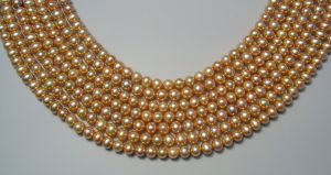Wholesale Freshwater Cultured Rose Gold Pearls Rounded Potato Strands ...